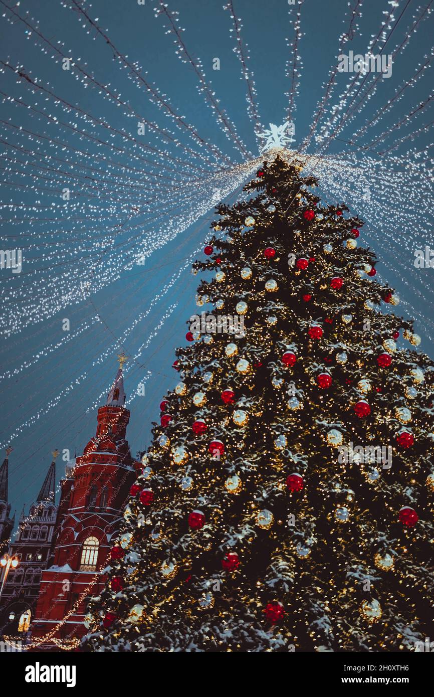 Christmas tree in Moscow decorated with gold balls, star, garlands ...