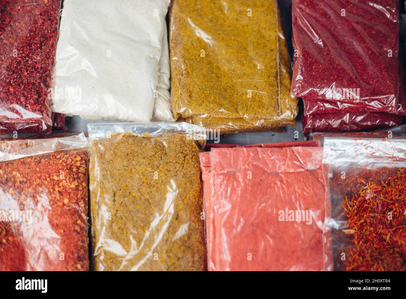Packages with prepackaged spices and herbs for cooking - an abundance ...