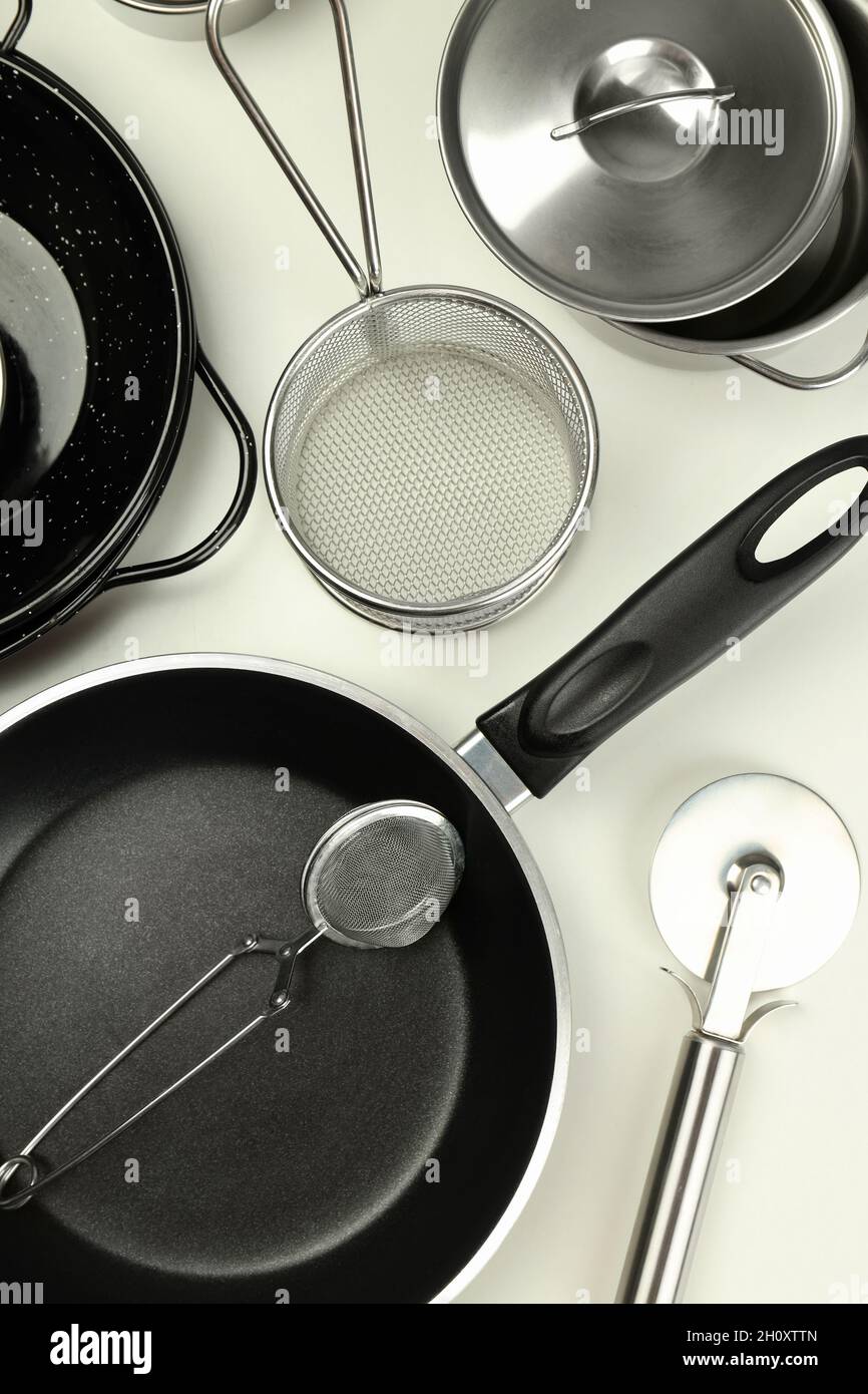 Set of different kitchen utensil on white background Stock Photo - Alamy