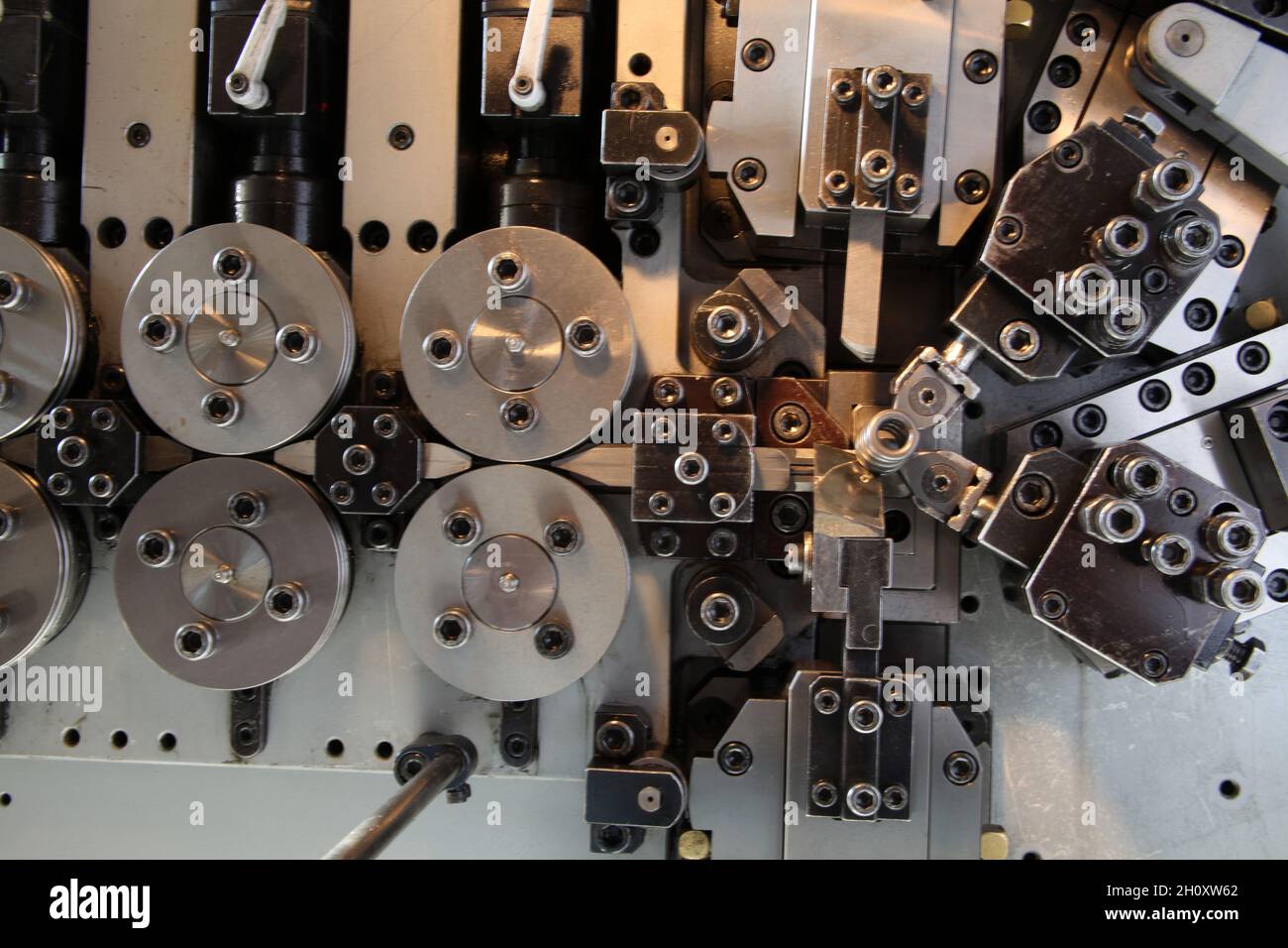 CNC spring making machine. Industrial machine Stock Photo - Alamy