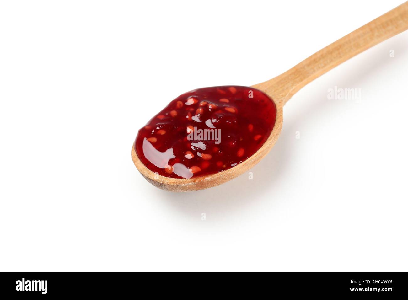 Spoon of raspberry jam isolated on white background Stock Photo - Alamy