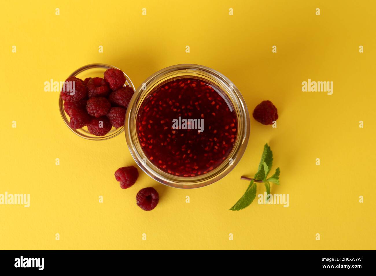 Jar of raspberry jam with ingredients on yellow background Stock Photo ...