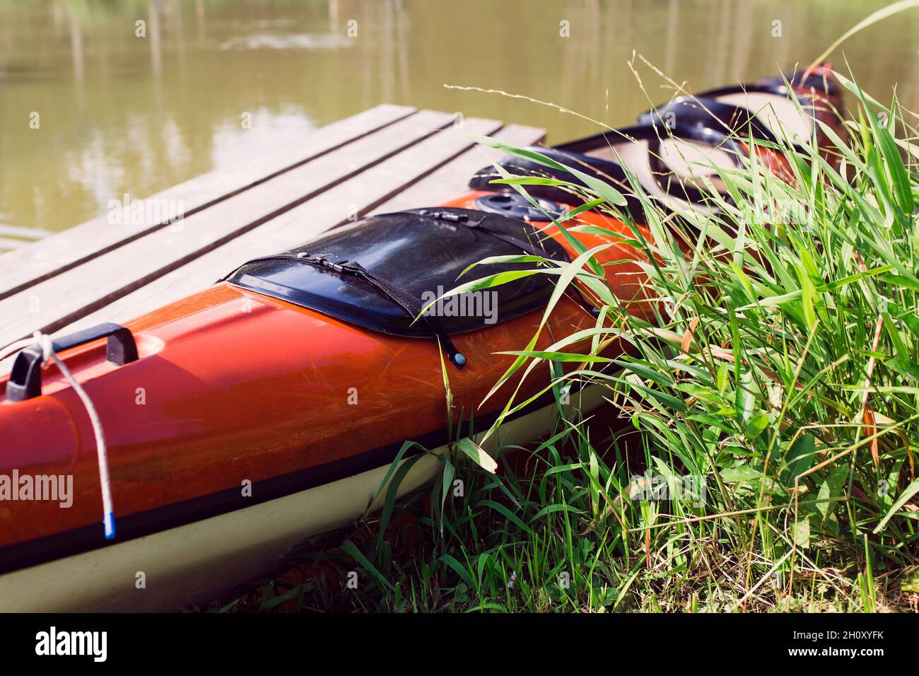 Two seater orange kayak ready for river rafting - active tourism Stock ...