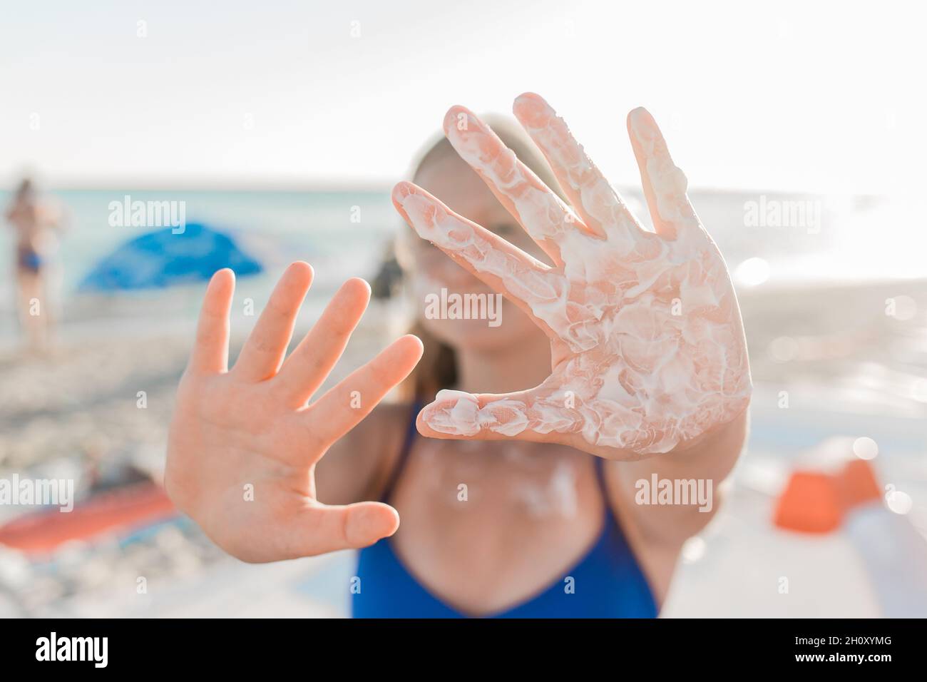 Woman cream applying arms hi-res stock photography and images - Alamy