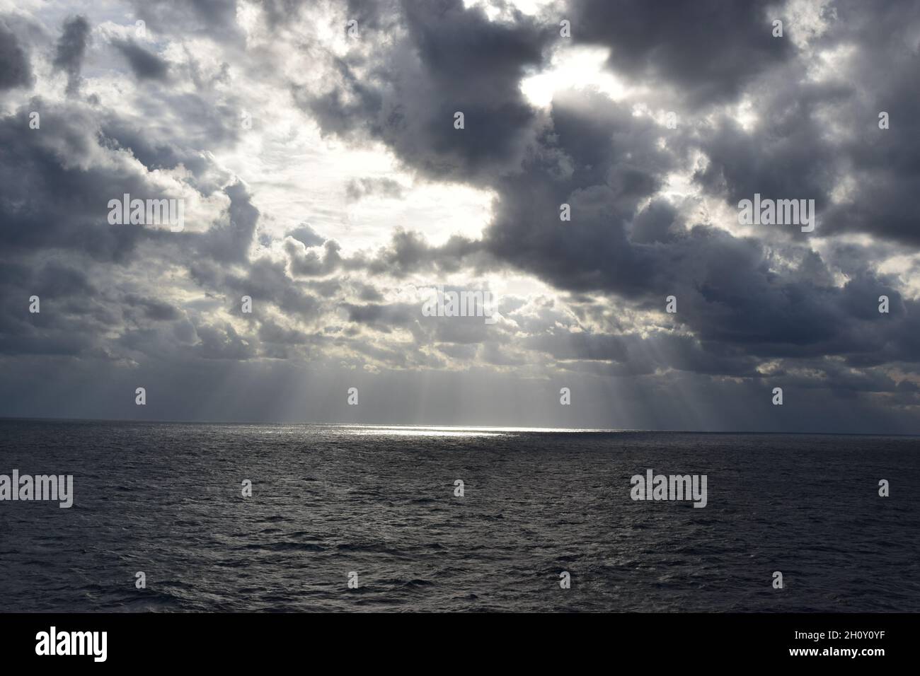 SUN RAYS OVER THE ATLANTIC OCEAN Stock Photo - Alamy
