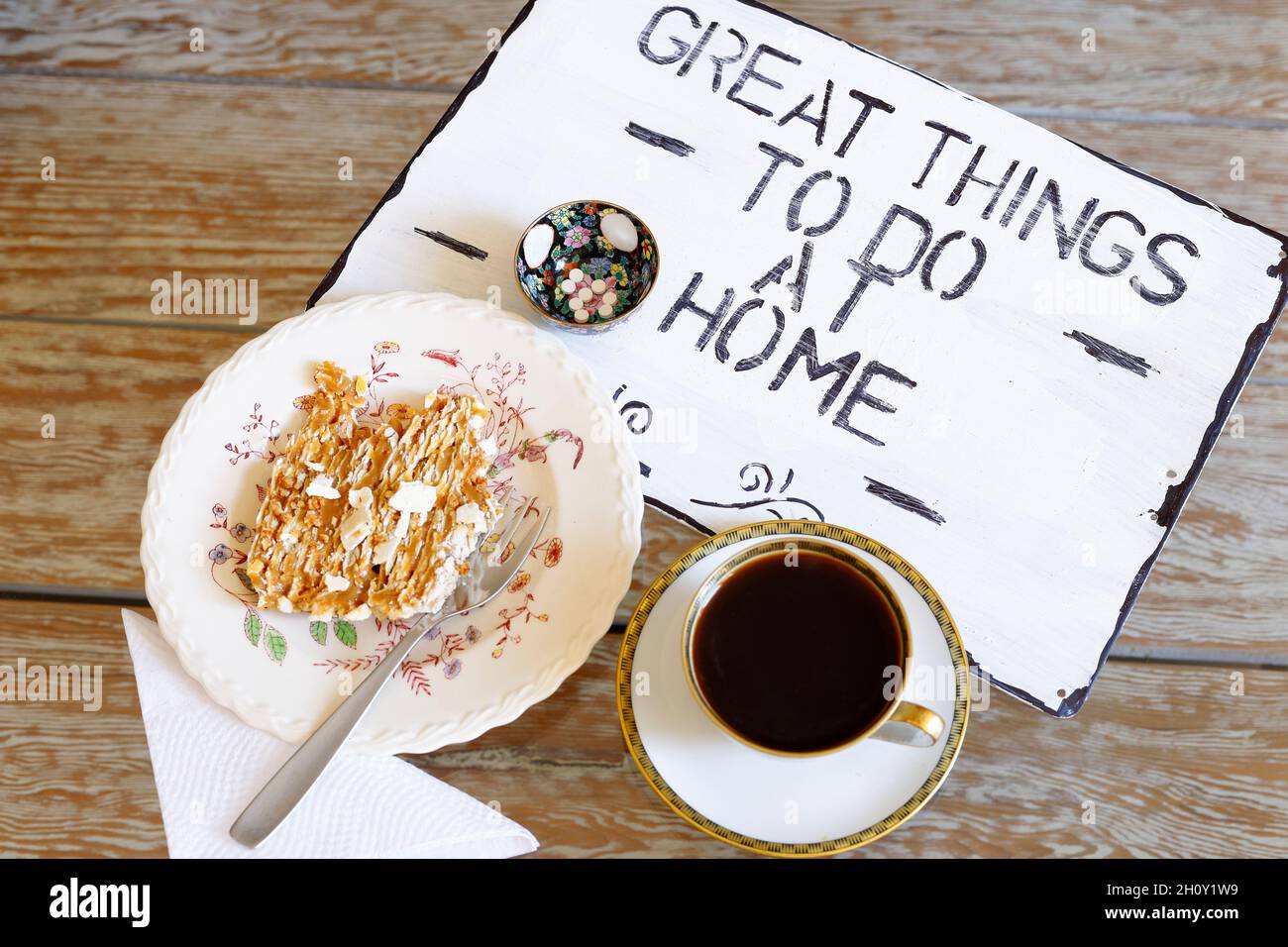 coffee and cake with great things to do at home poster Stock Photo - Alamy