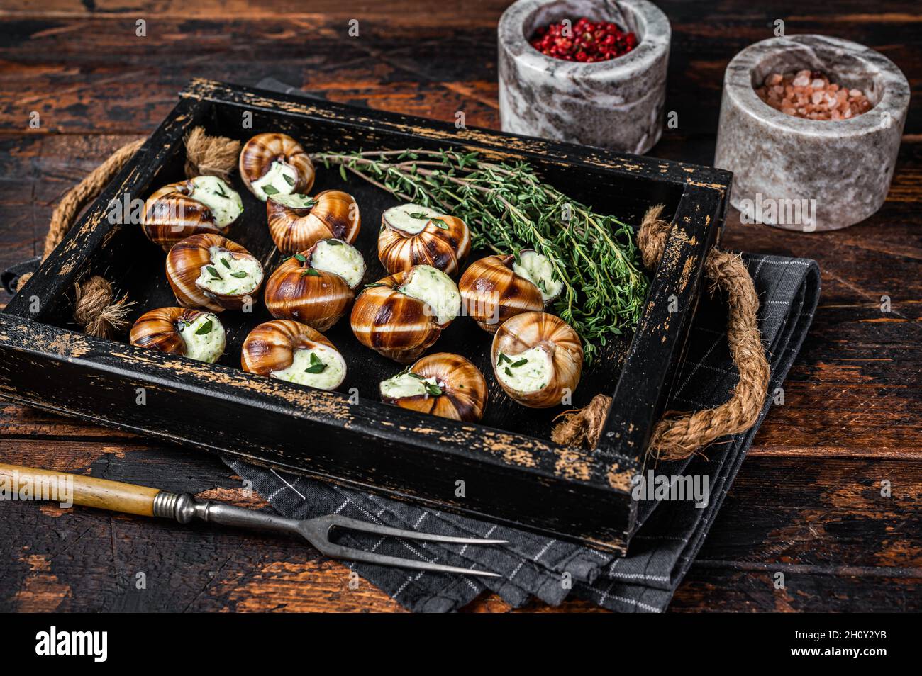 French gourmet - Escargot Snails with garlic butter in a wooden tray ...