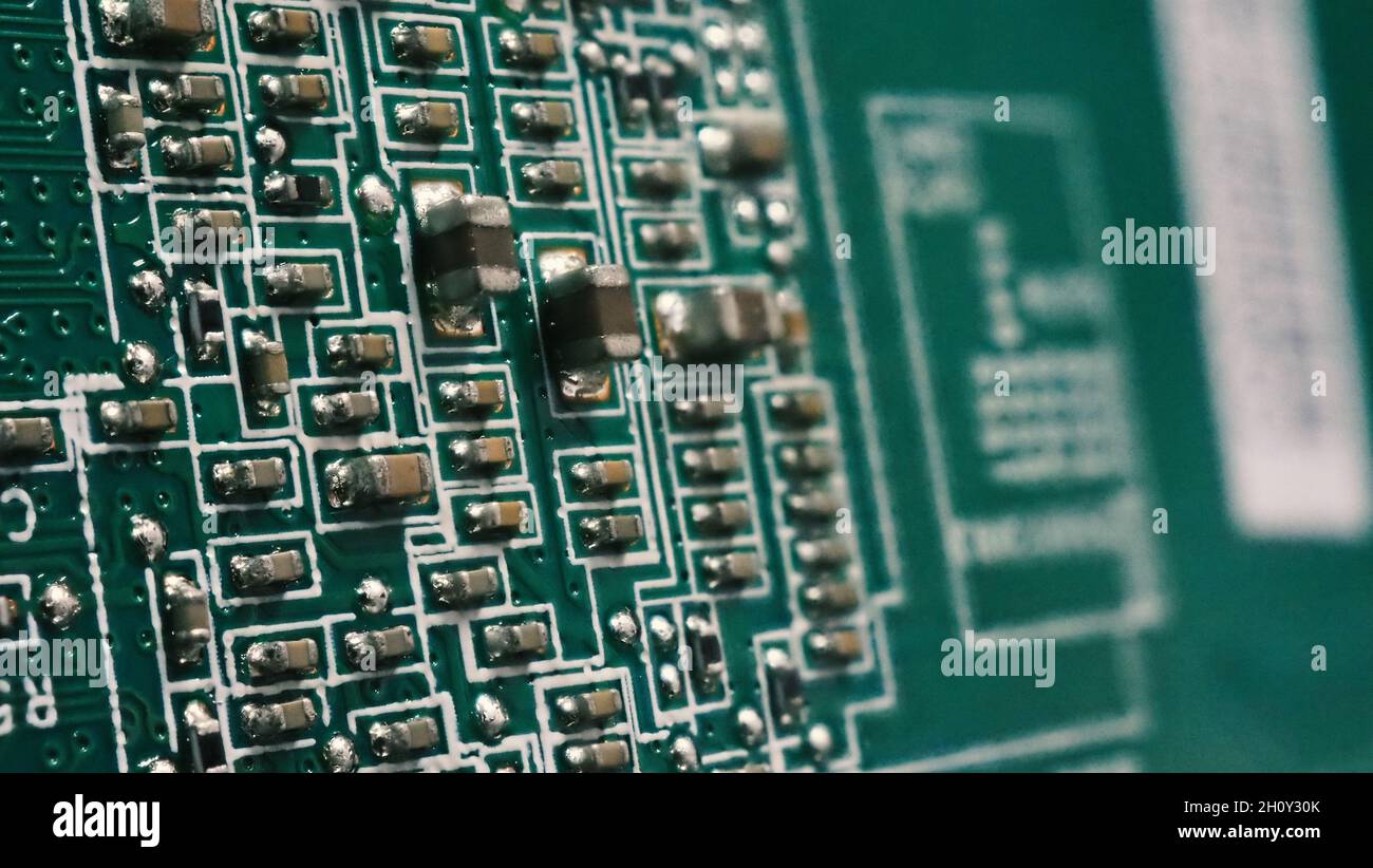 Semiconductor. cpu chip located on the green motherboard of the ...