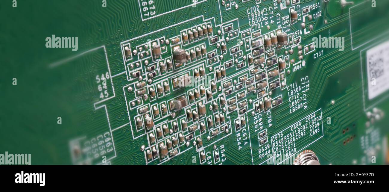 Semiconductor. cpu chip located on the green motherboard of the ...