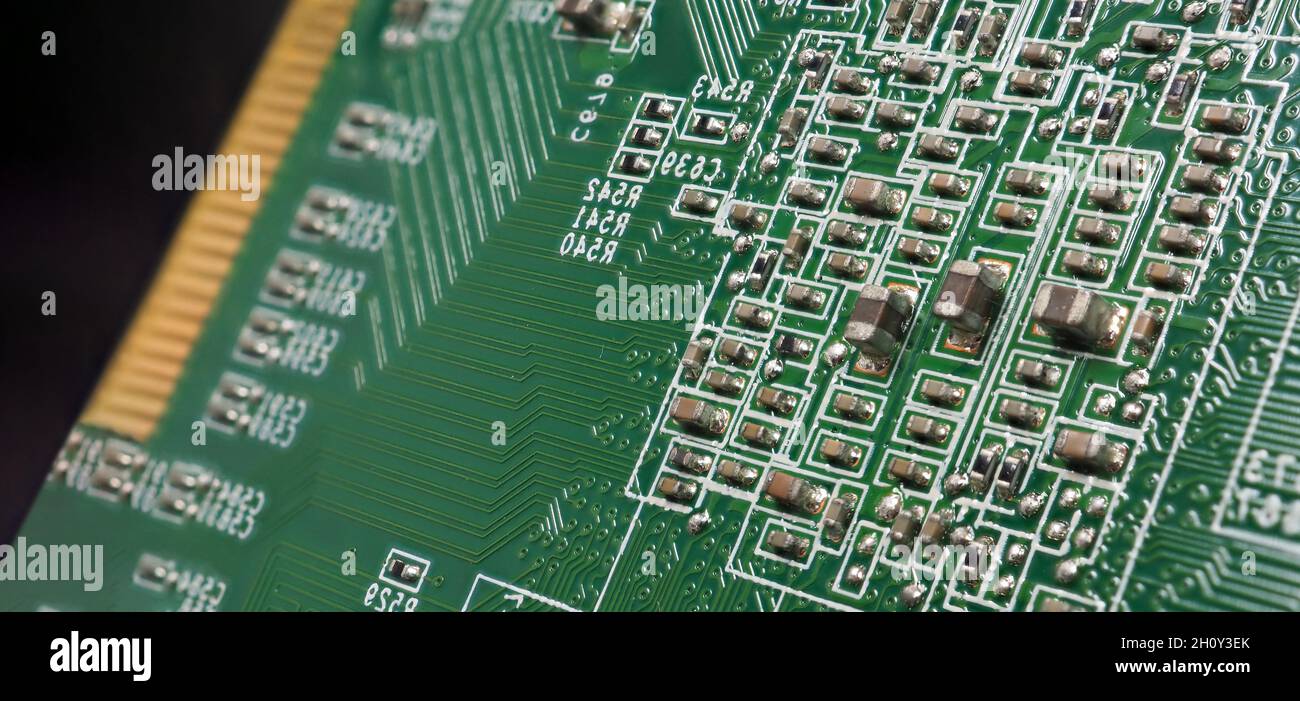 Semiconductor. cpu chip located on the green motherboard of the ...