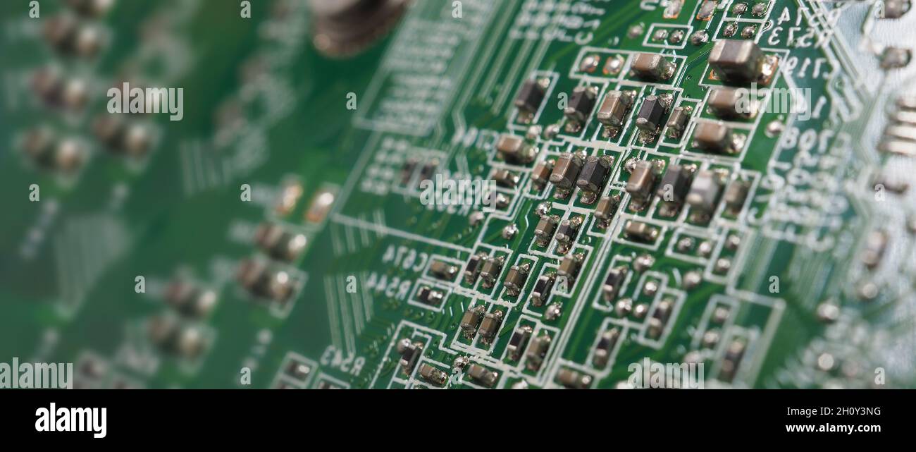 Semiconductor. cpu chip located on the green motherboard of the ...