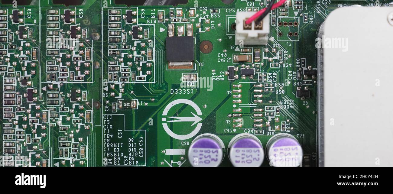 Semiconductor. cpu chip located on the green motherboard of the ...