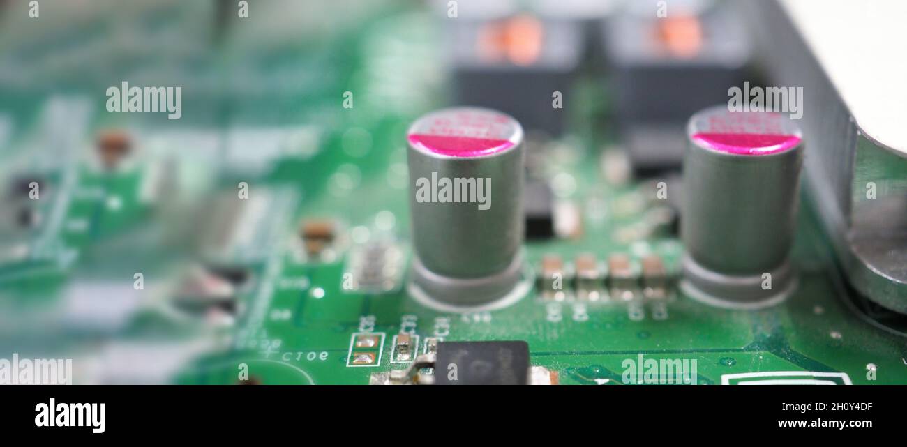 Semiconductor. cpu chip located on the green motherboard of the ...