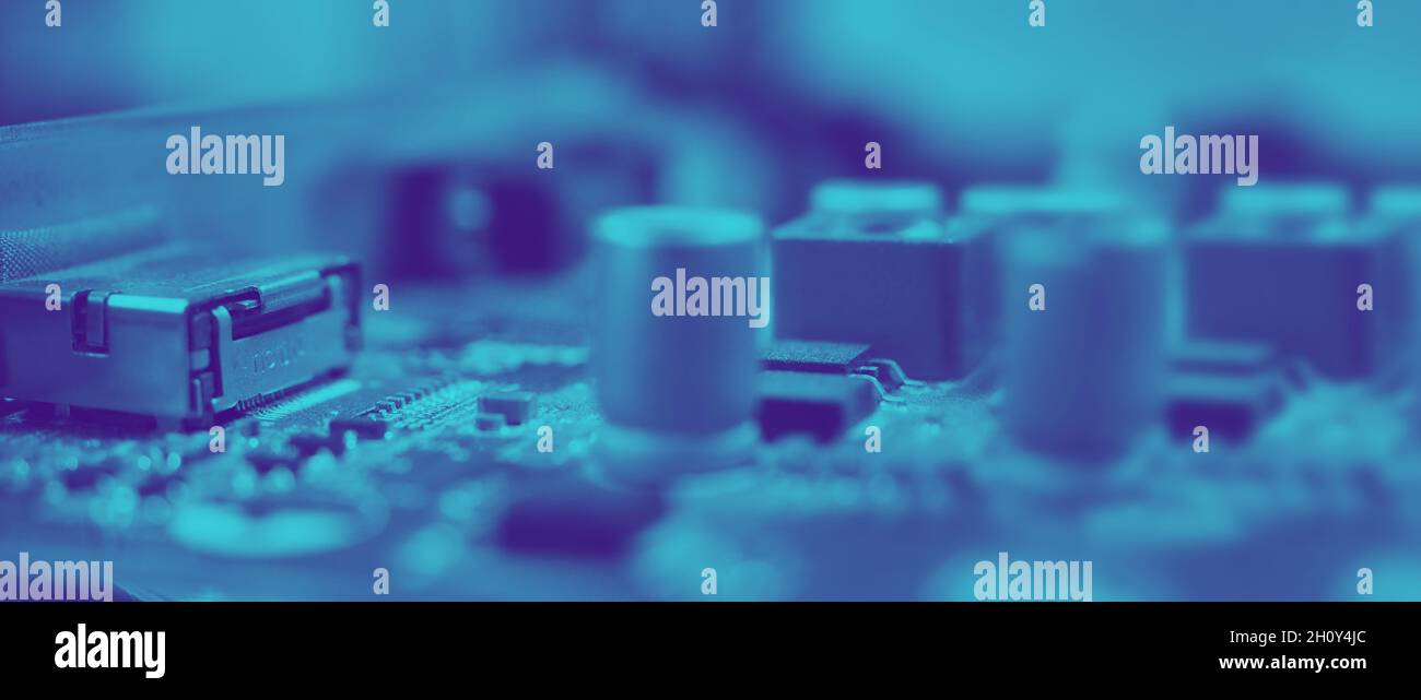 Semiconductor. cpu chip located on the green motherboard of the ...