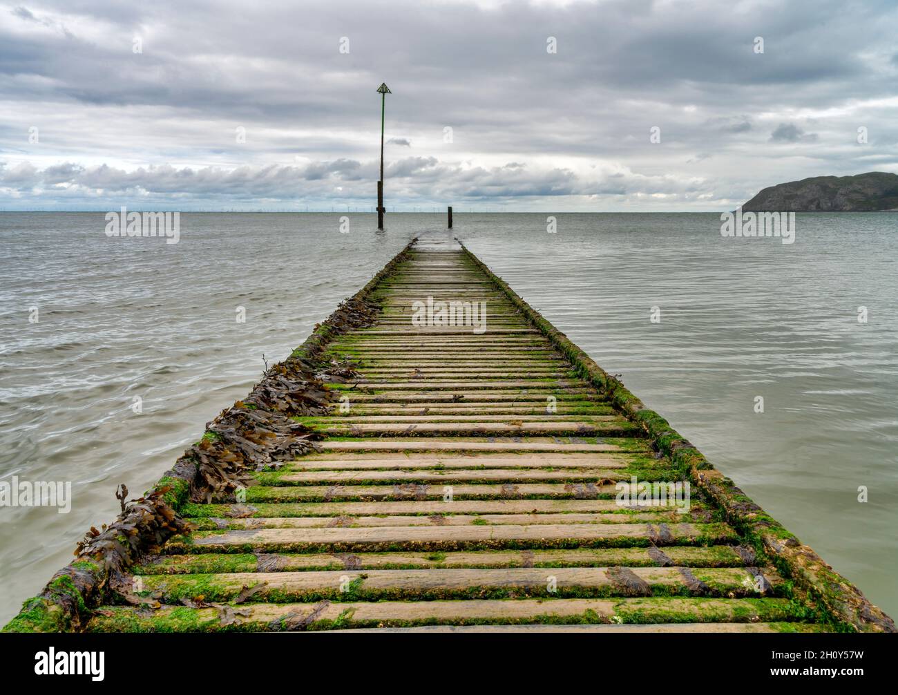 A boardwalk jutting into the sea at Llandudno, North Wales, UK Stock ...