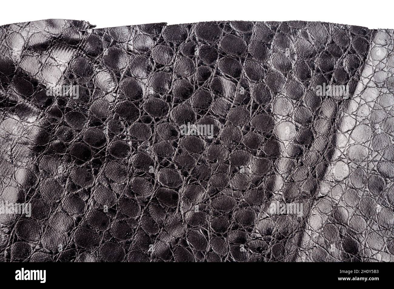 Piece of black artificial leather isolated on white background. Fake ...