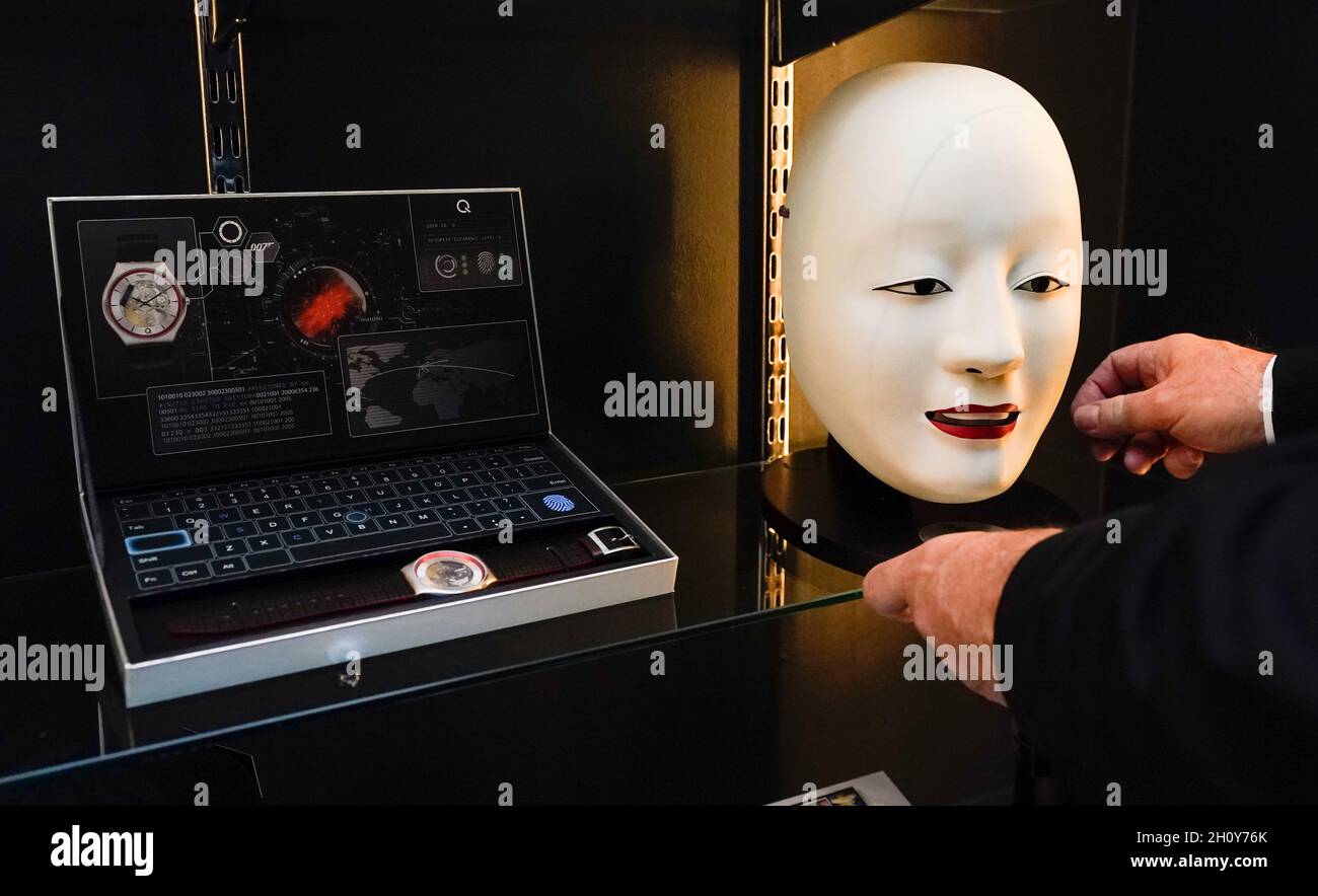 A person places a replica of the Safin mask into a display cabinet at ...