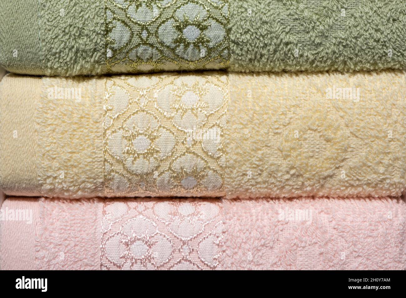 Stack of Rolled Towels with ornament for hotels and saunas in various ...