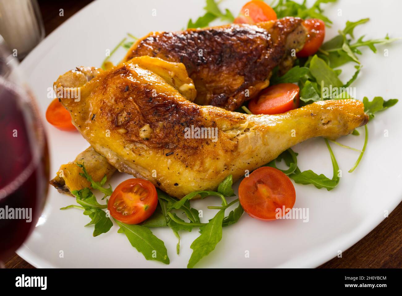 Roasted chicken legs with golden crust Stock Photo - Alamy