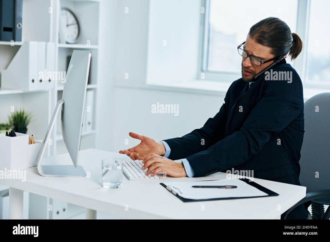 office worker in the office gestures with his hands computer Stock ...