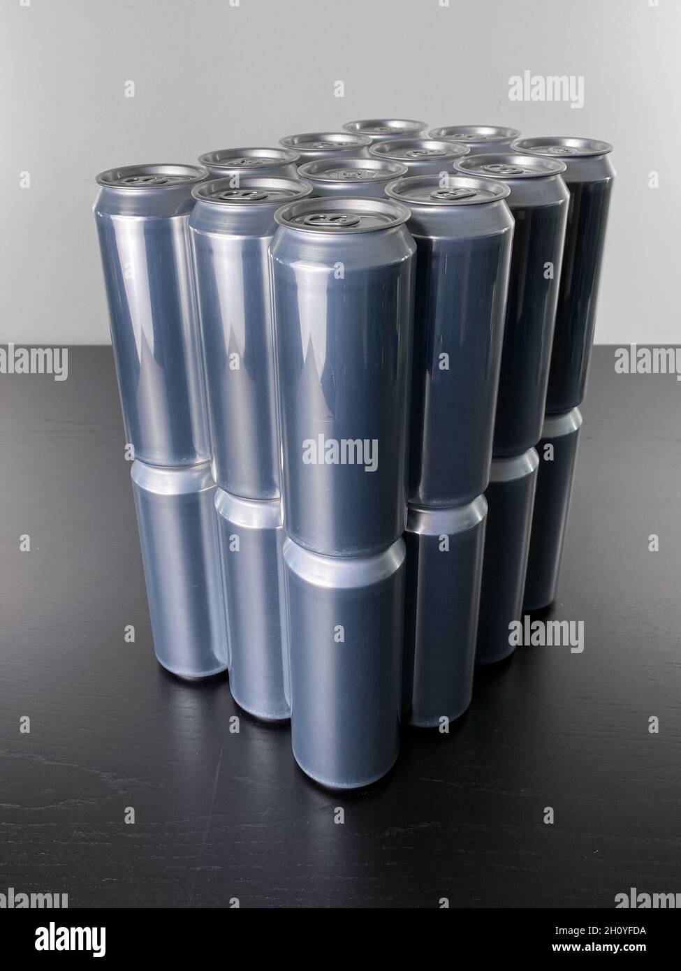 Vertical shot of aluminum cans before labeling Stock Photo - Alamy
