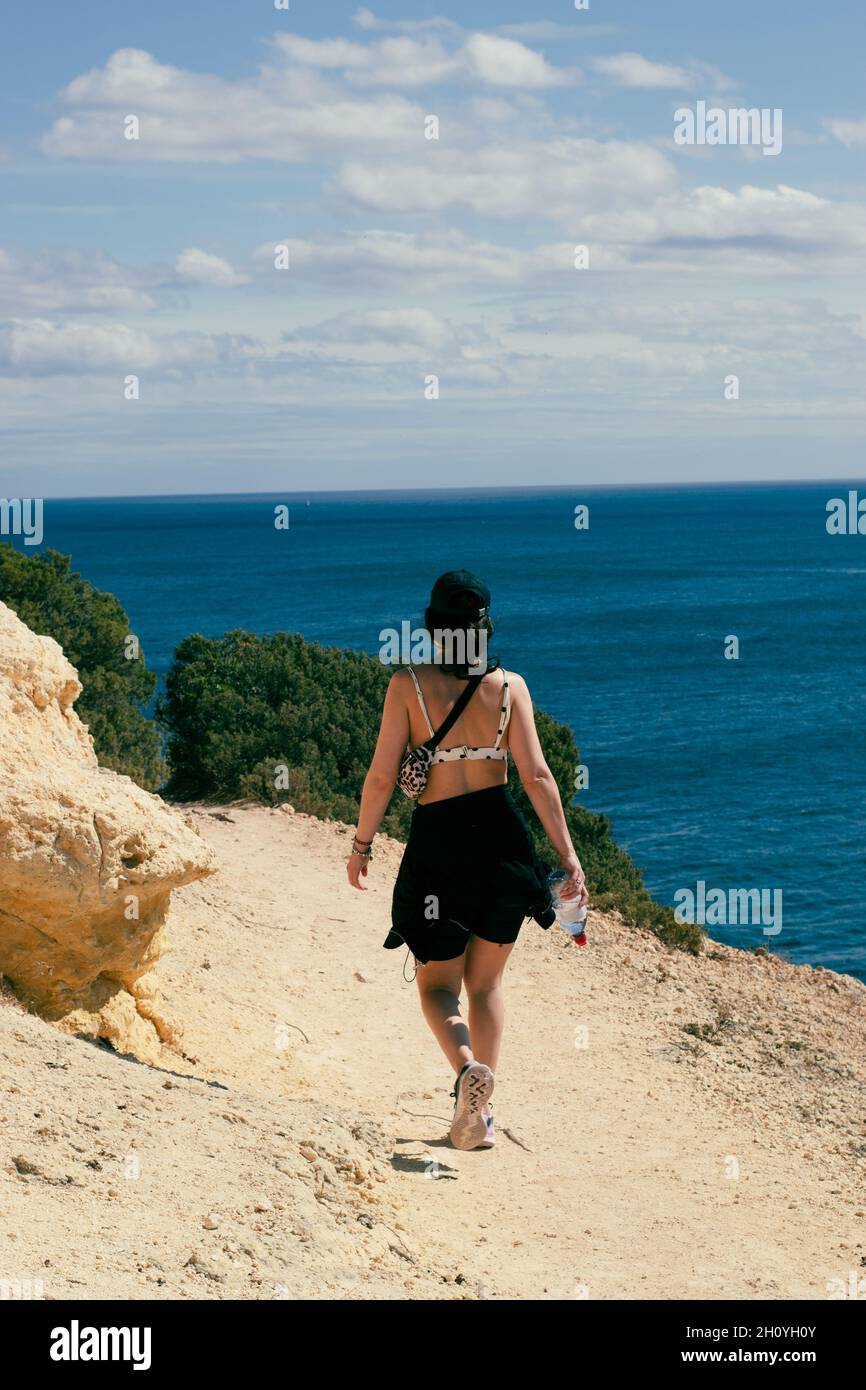 young girl posing on cliff Stock Photo - Alamy