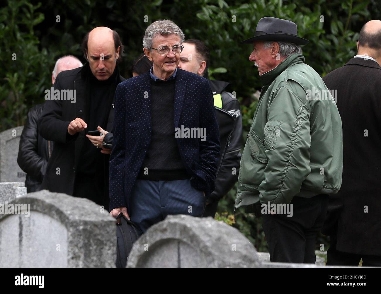 Kevin Conneff (second left) of the Chieftains attends the funeral of ...