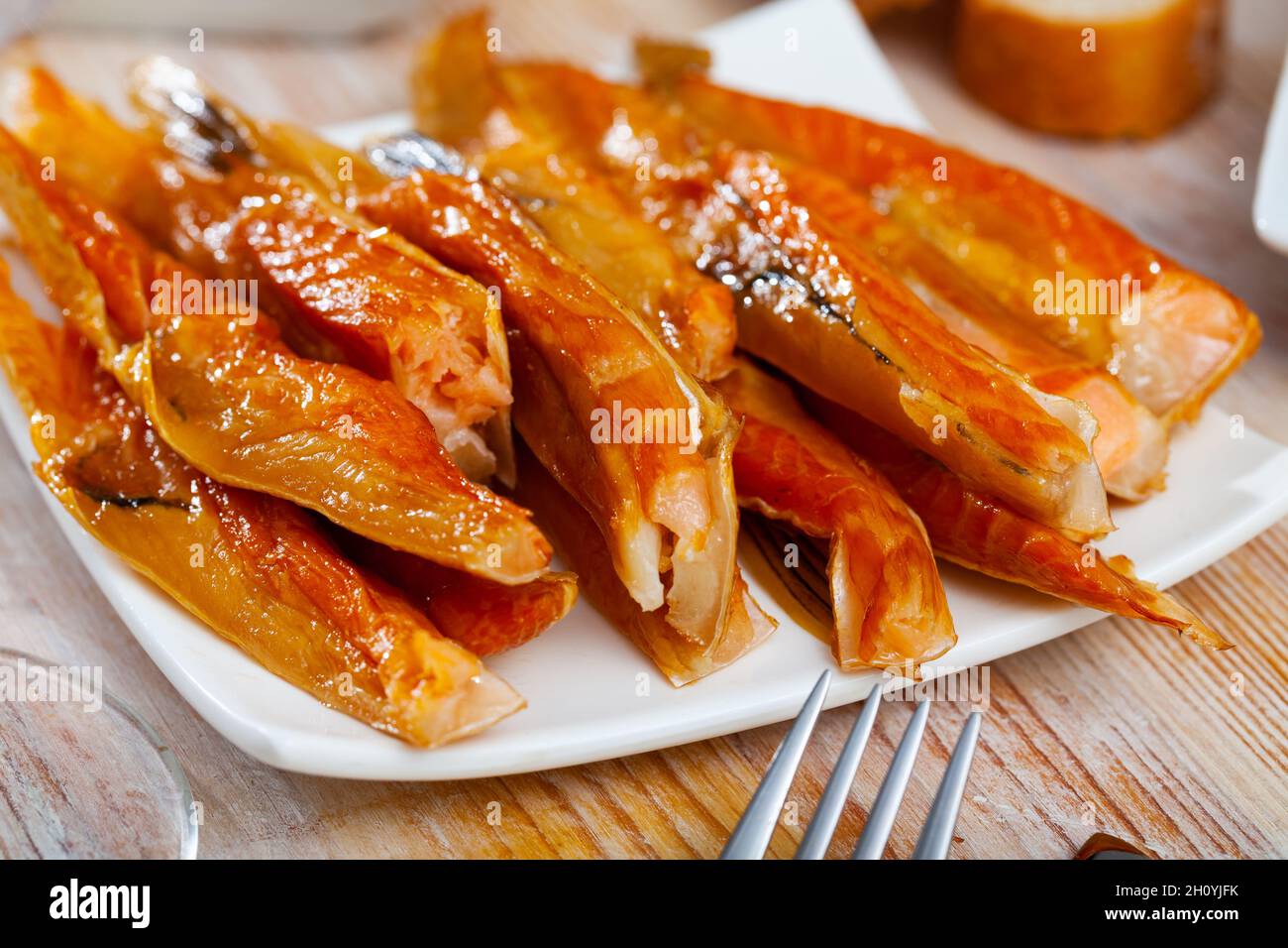 Cold smoked salmon belly strips Stock Photo - Alamy