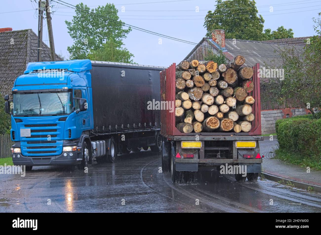 Two trucks passing each other Stock Photo - Alamy