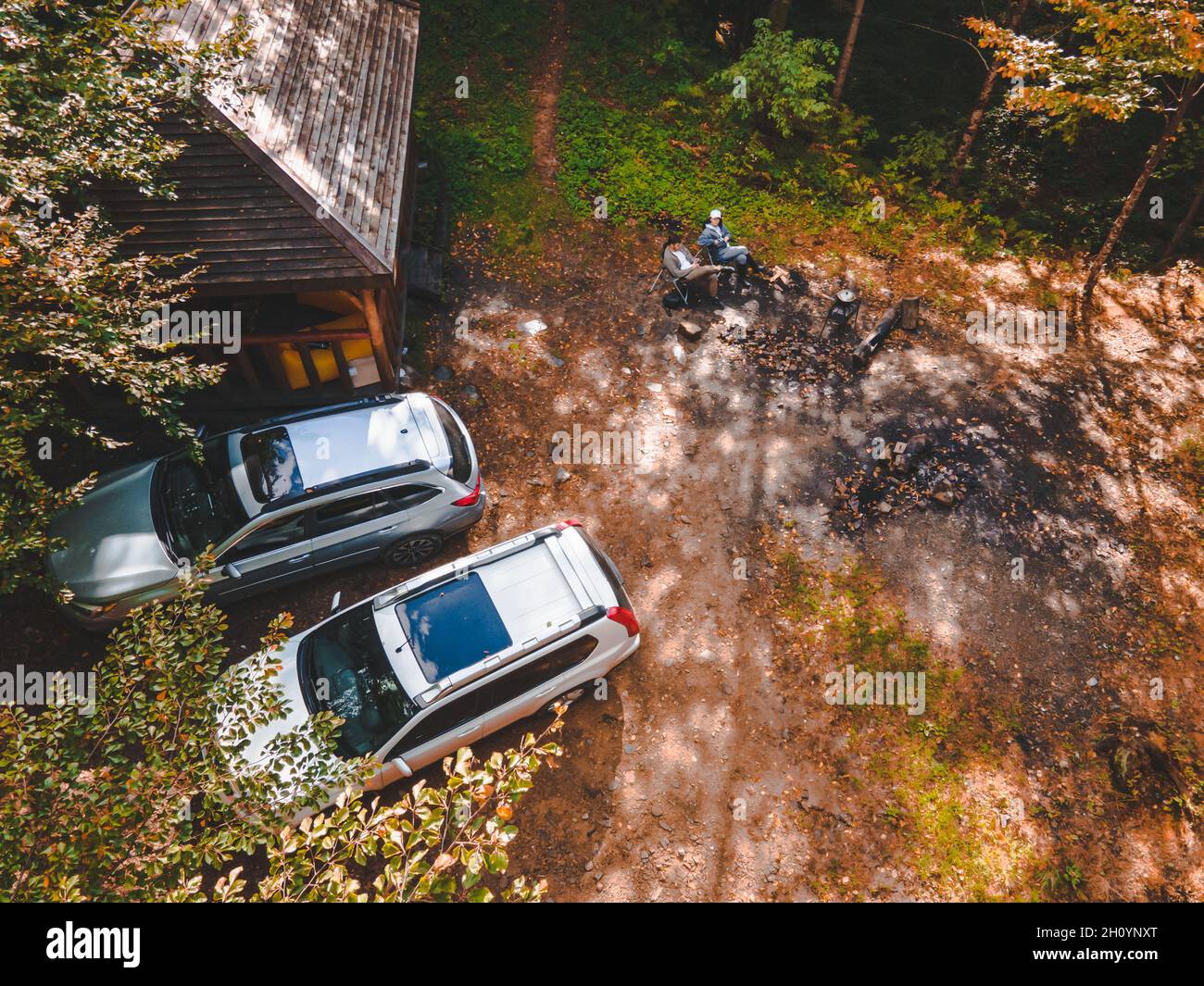 overhead top view of bbq site in forest two parked suv cars Stock Photo ...