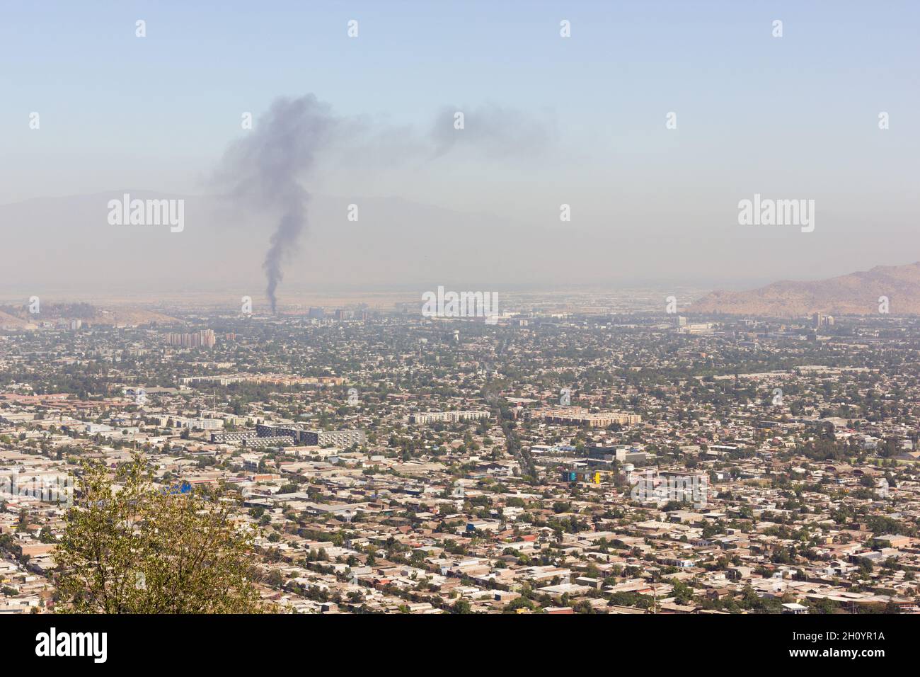 Santiago city aerial view with fire smoke on background. Sunny day on ...