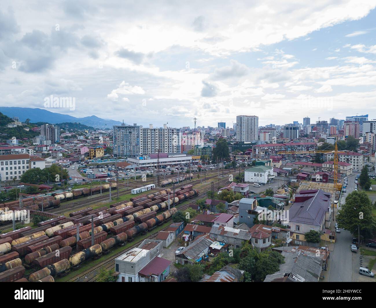 Drone view of railway trains, the city, the mountains in Batumi on a ...