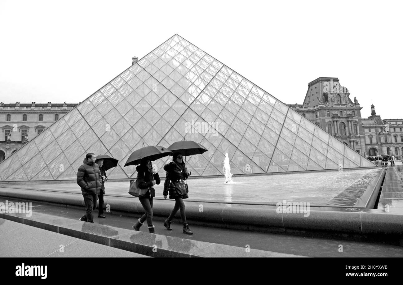 Rain in Louvre Paris Stock Photo - Alamy