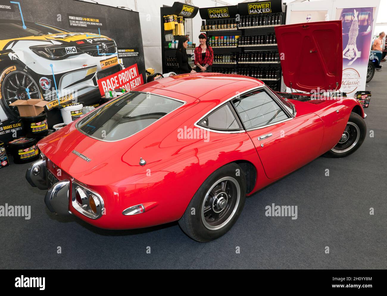 Three-quarter rear view of a Red, 1967, Toyota 2000 GT, on display at ...