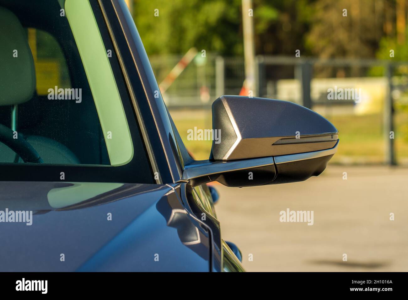 Close up front view of car side mirror. Front rear view mirror on the ...
