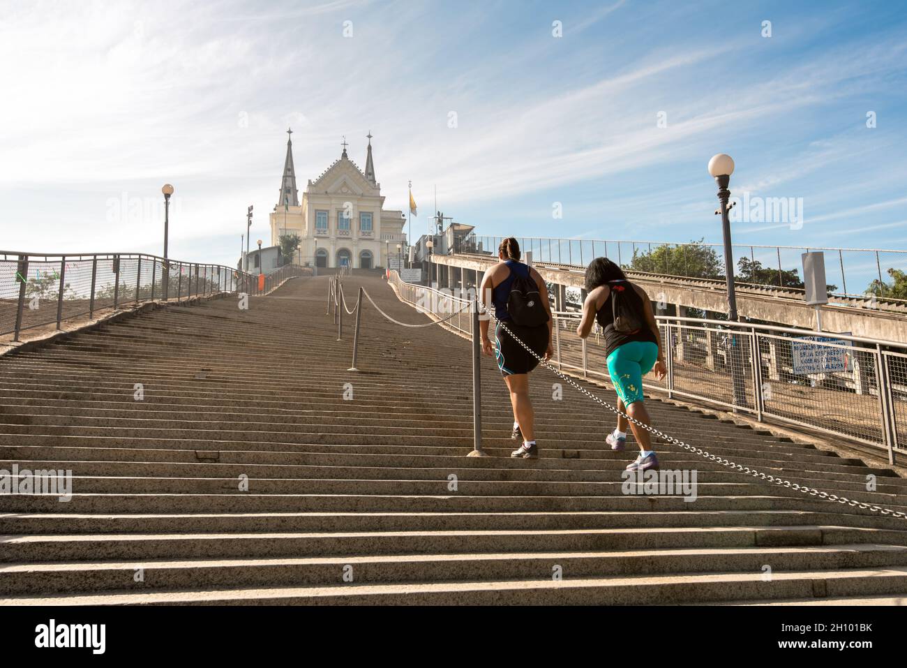 Two women climbing the 382 steps to the Penha Church in Rio de Janeiro ...