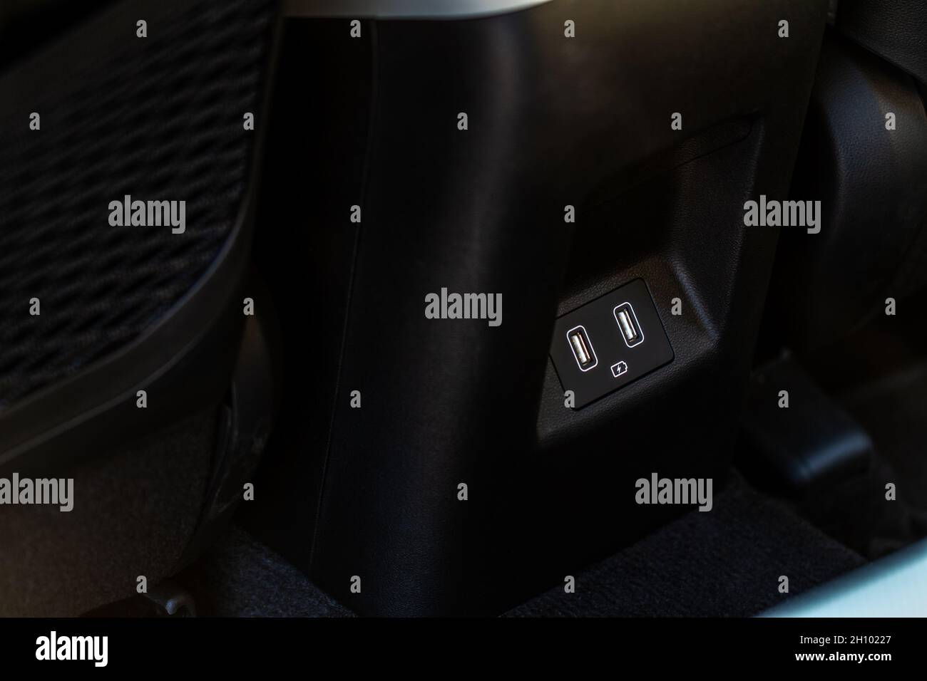 Opened car USB port in the car for connecting device. Power output of ...