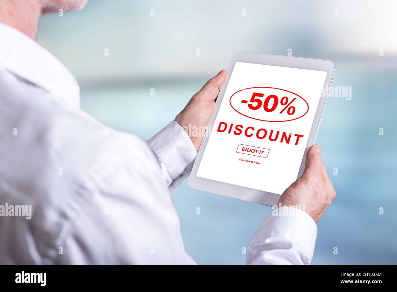 Tablet screen displaying a discount concept Stock Photo - Alamy