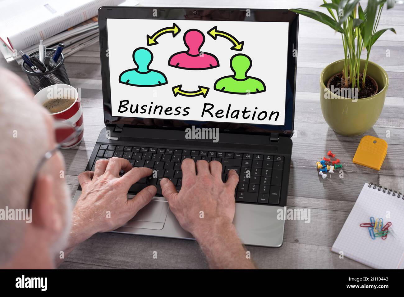 Business relation concept shown on a laptop used by a man Stock Photo ...