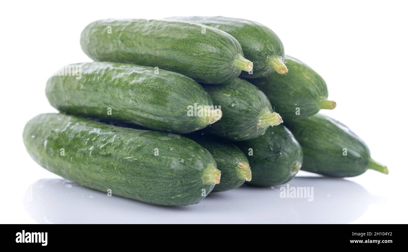 Heap of fresh mini cucumbers, isolated on white Stock Photo - Alamy
