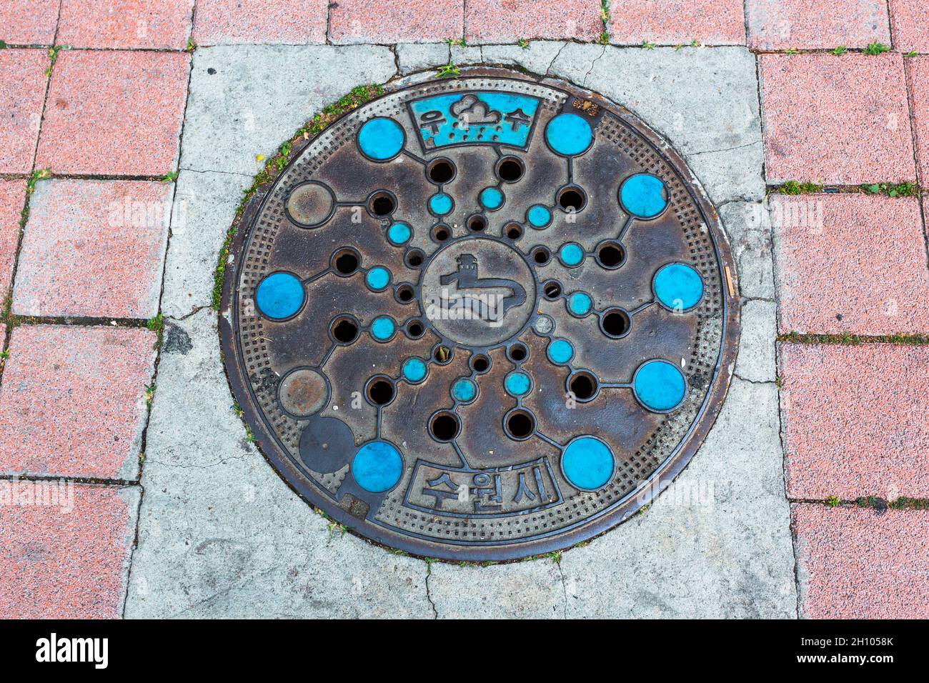 Seoul, South Korea - June 25, 2017: Round sewer hatch on the street in ...