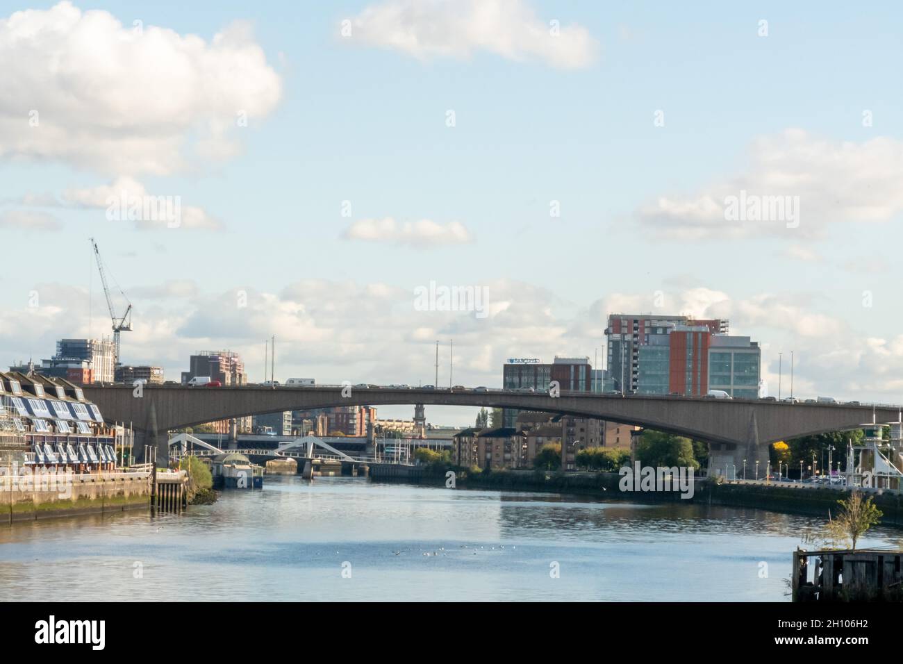 The M8 motorway bridge, the Kingston Bridge, crosses the River Clyde ...