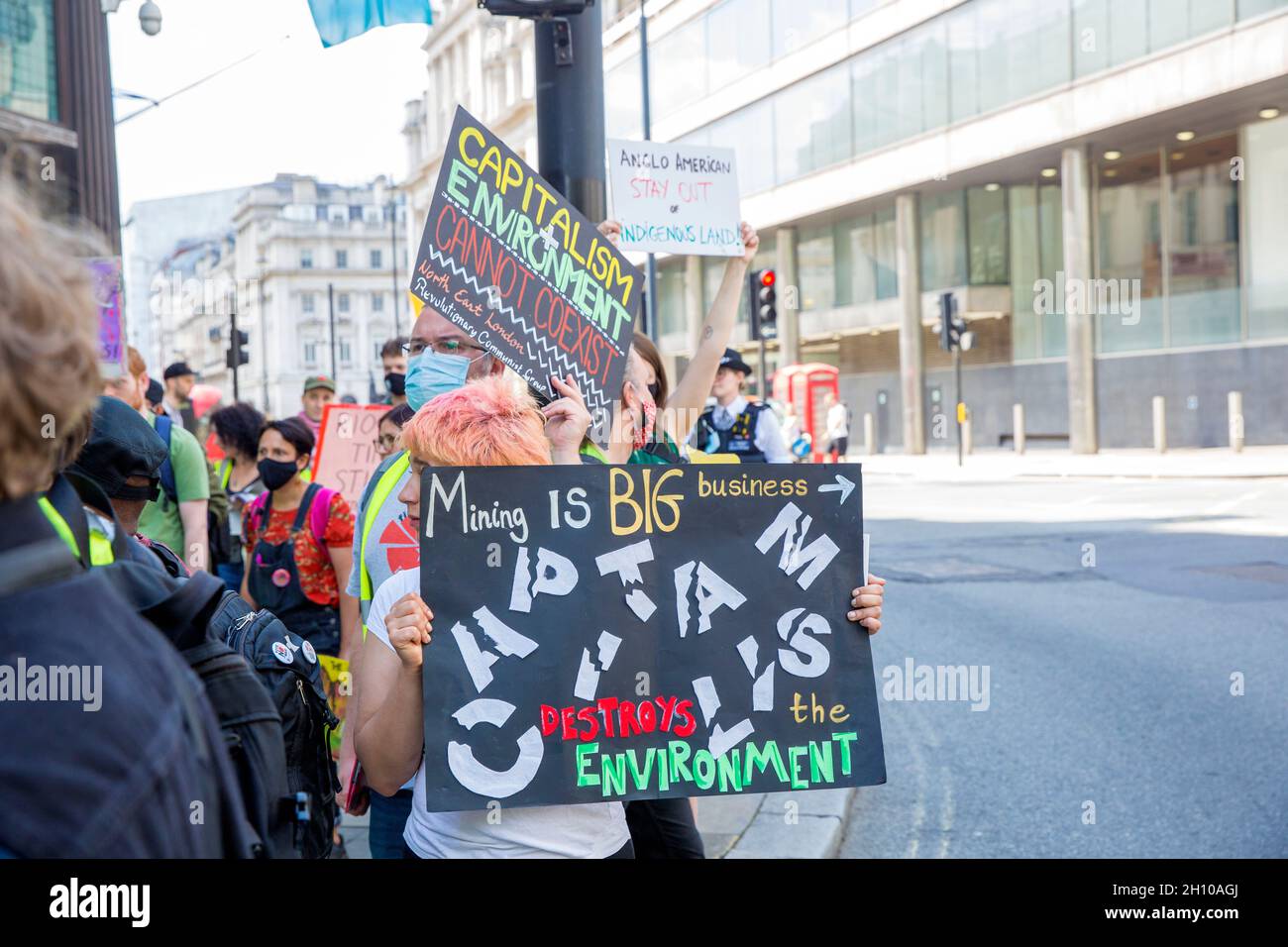 People stage a demonstration for protecting the environment outside the ...