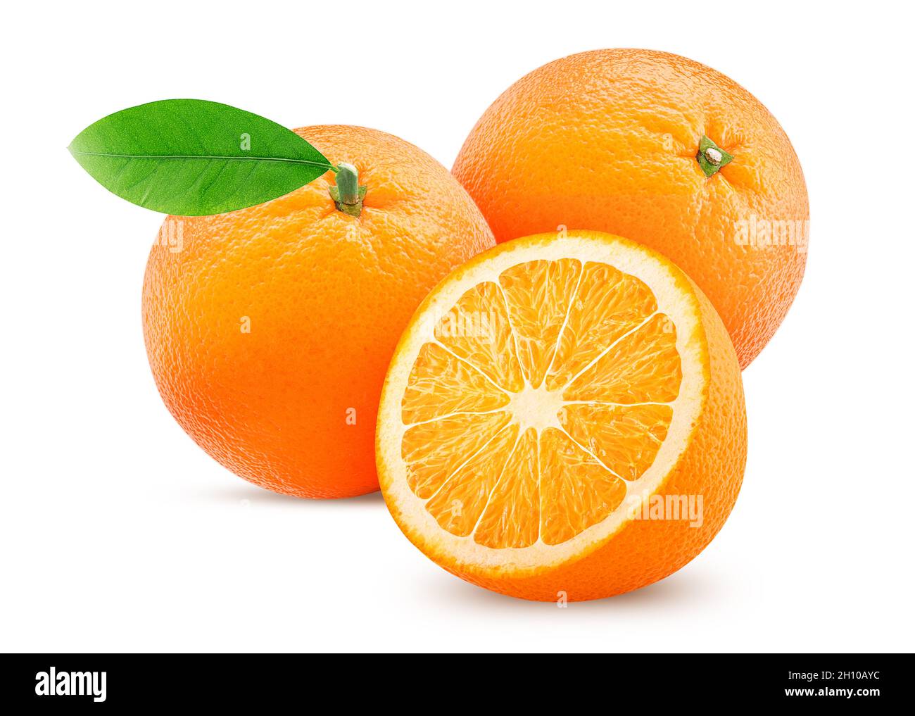 Two orange fruit and one cut in half, with leaf isolated on white ...