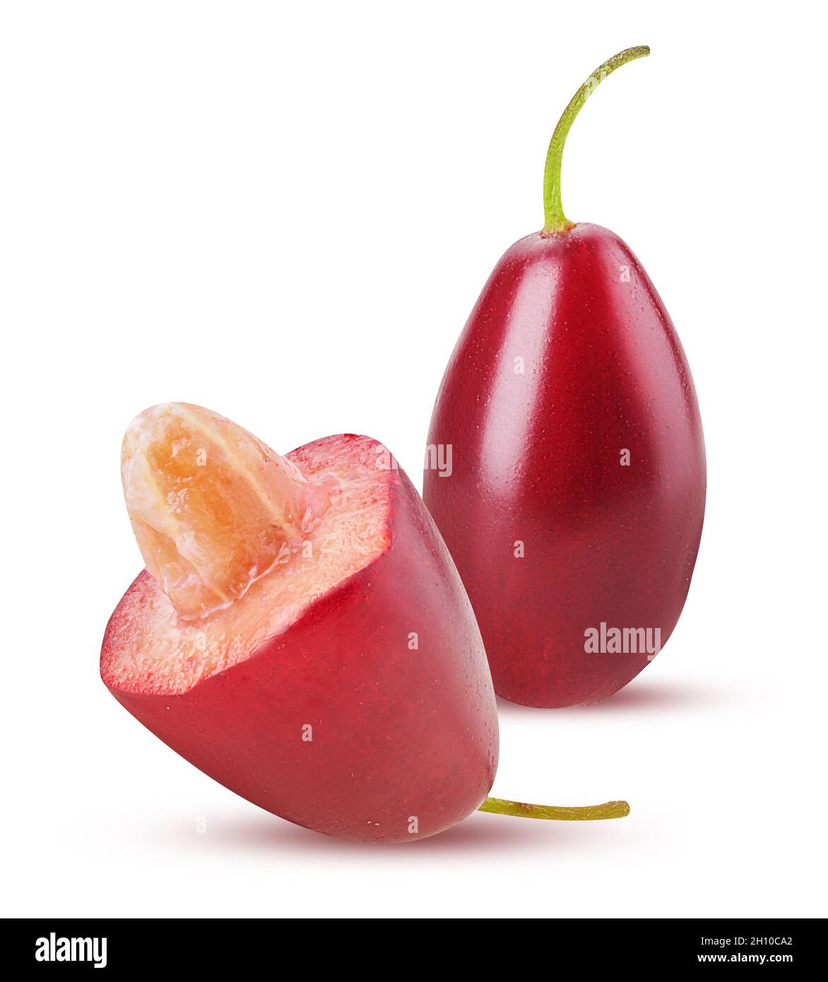 Cornel berries one cut in half with bone isolated isolated on white ...