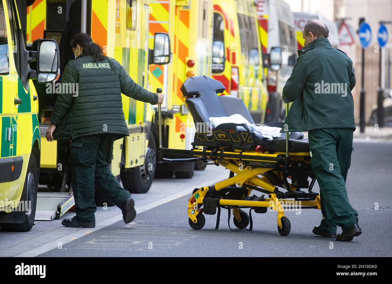 London, UK. 15th Oct, 2021. Queues of ambulances and a steady stream of ...