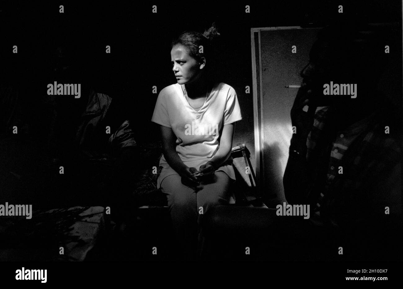 Ethiopian woman sitting inside a makeshift hut. Addis Ababa, Ethopia ...