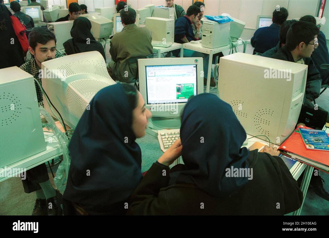 Young boys and girls studying in computer room. Iran Stock Photo - Alamy