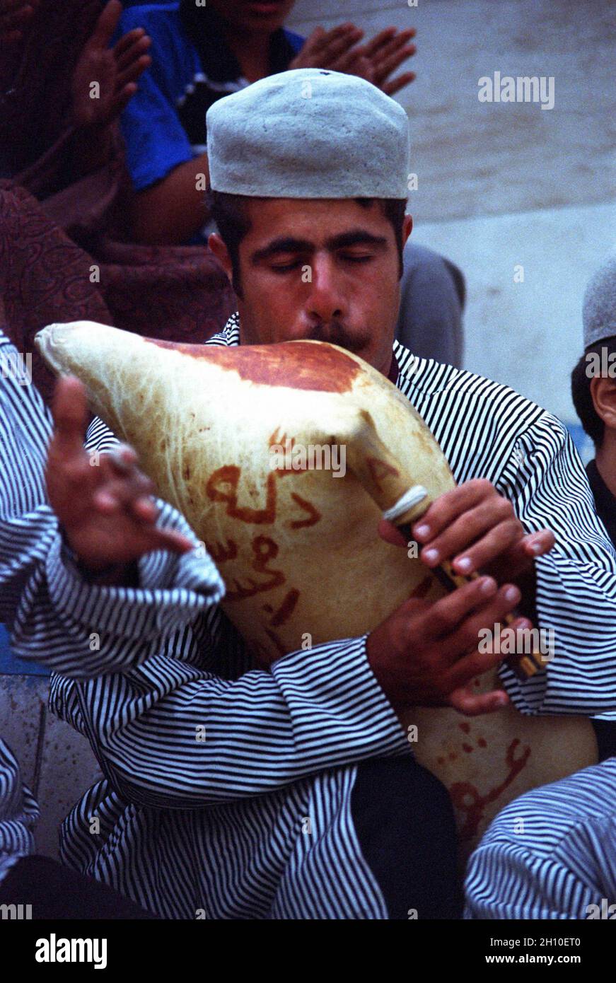 An Iranian tribal young plays an Iranian traditional music instrument ...