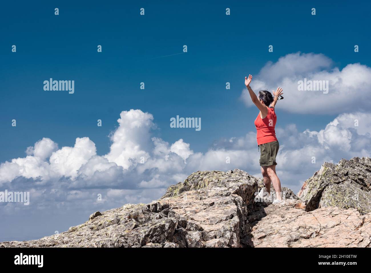 Woman looking down on the valley from a mountain hi-res stock photography and images - Alamy